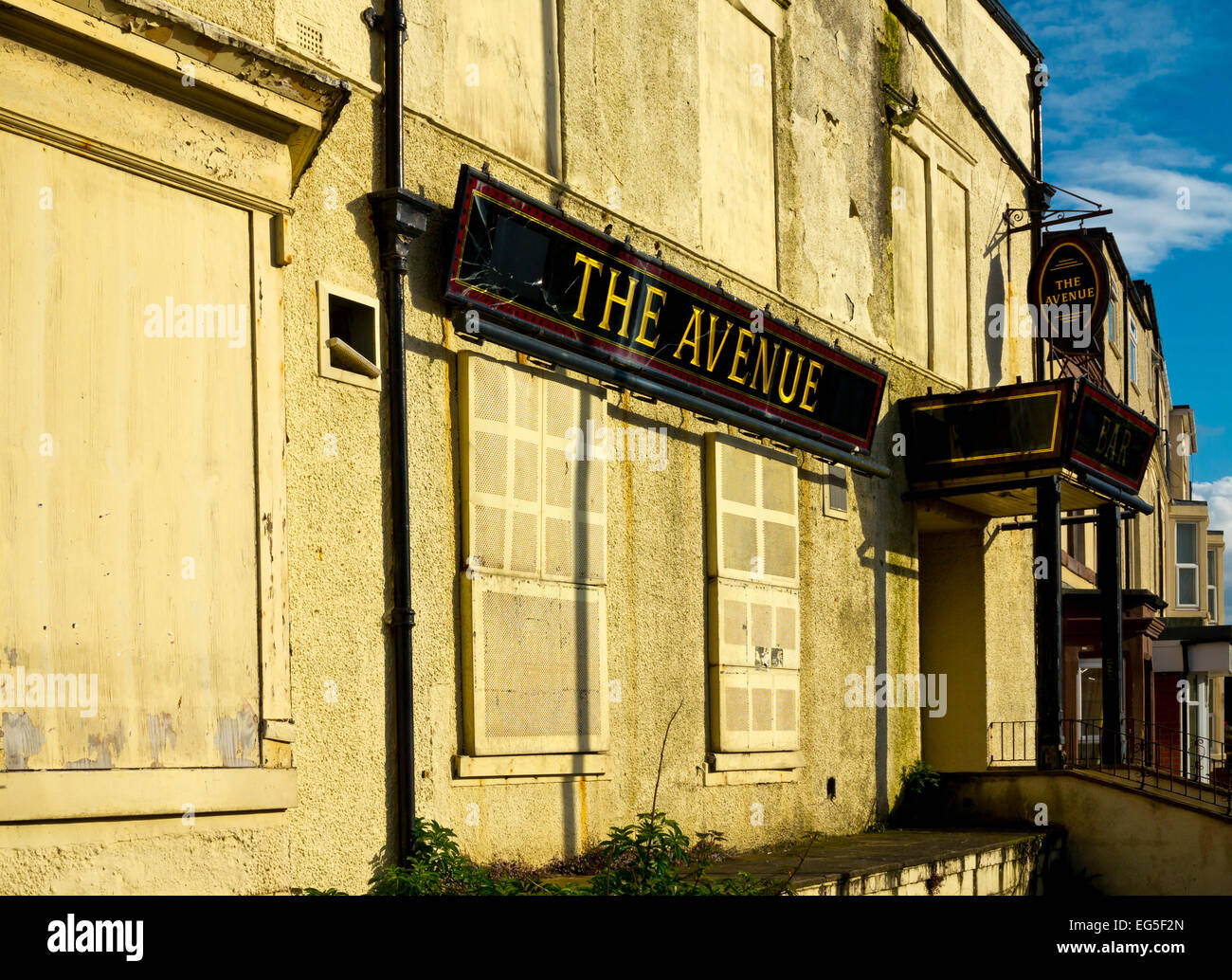 Boarded up pub with metal security plates covering windows in Whitley ...