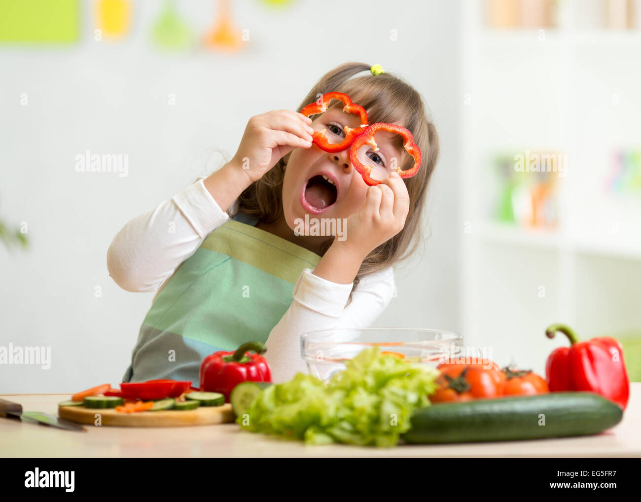 kid girl having fun with food vegetables Stock Photo - Alamy
