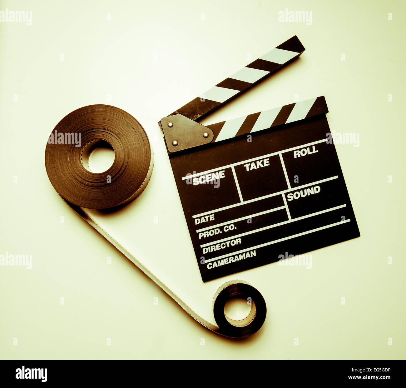 Two 35mm movie reels connected and clapperboard on right side in ...