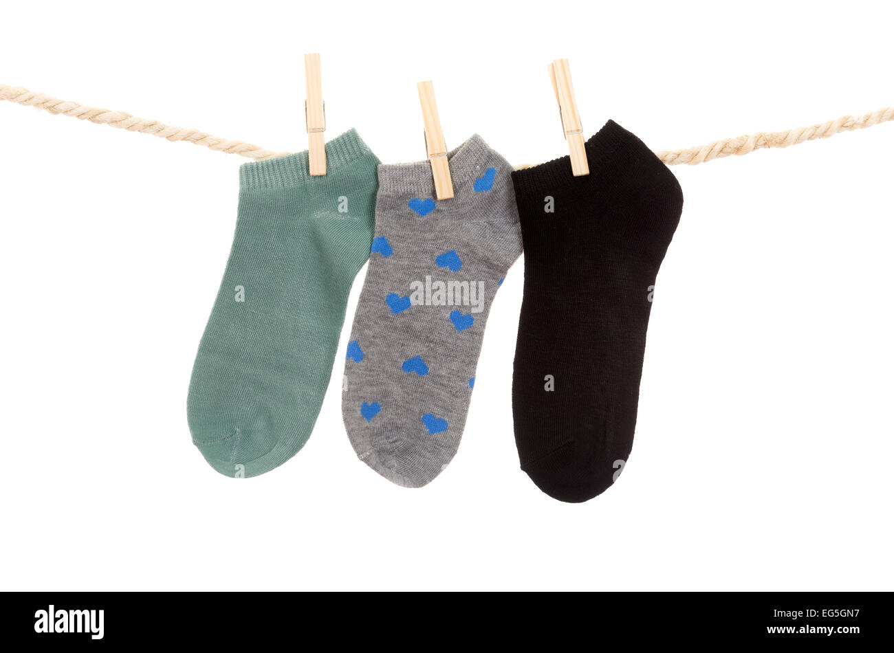 socks hanging on a rope clothesline Stock Photo - Alamy