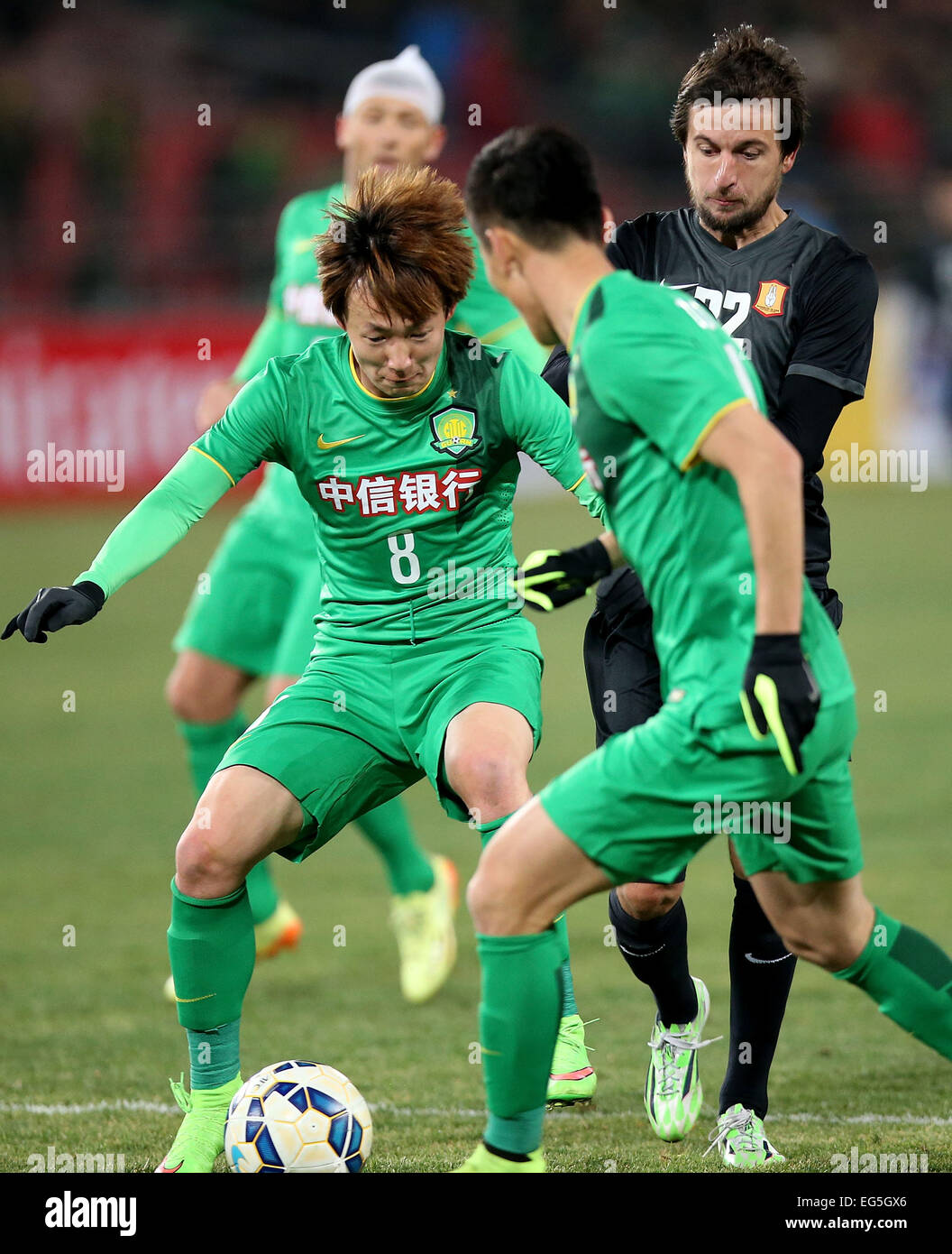 Beijing, China. 17th Feb, 2015. Piao Cheng (L) of China's Beijing Guoan ...