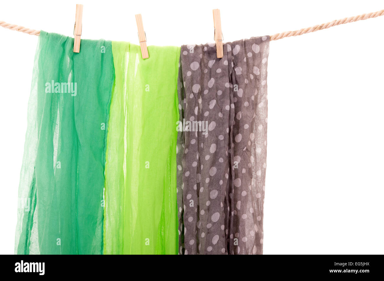 scarfs hanging on a rope clothesline Stock Photo - Alamy