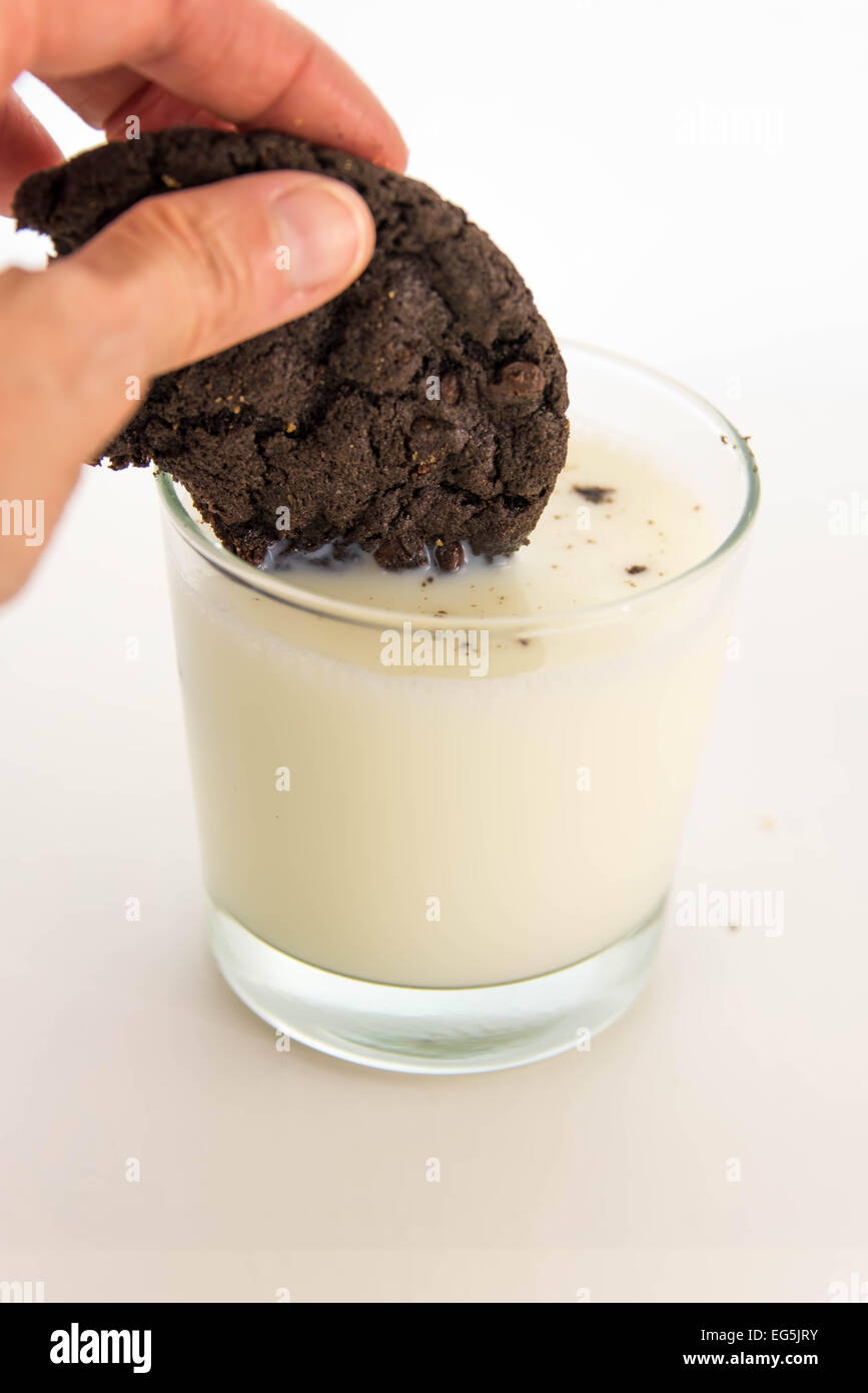 Cookie dunked glass milk hi-res stock photography and images - Alamy