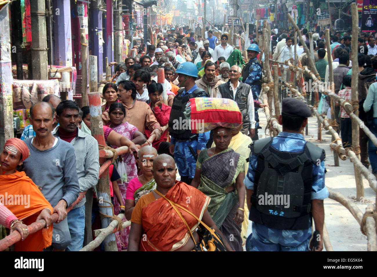 Varanasi, India. 17th Feb, 2015. Indian Hindu devotees queue up to ...