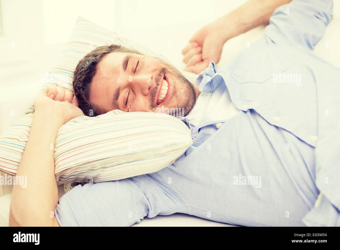 Lazy man sleep on sofa hi-res stock photography and images - Alamy