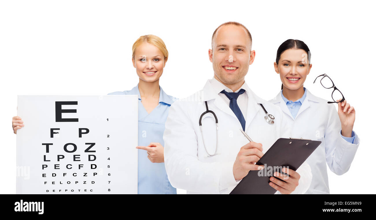 group of smiling doctors with eye chart Stock Photo - Alamy