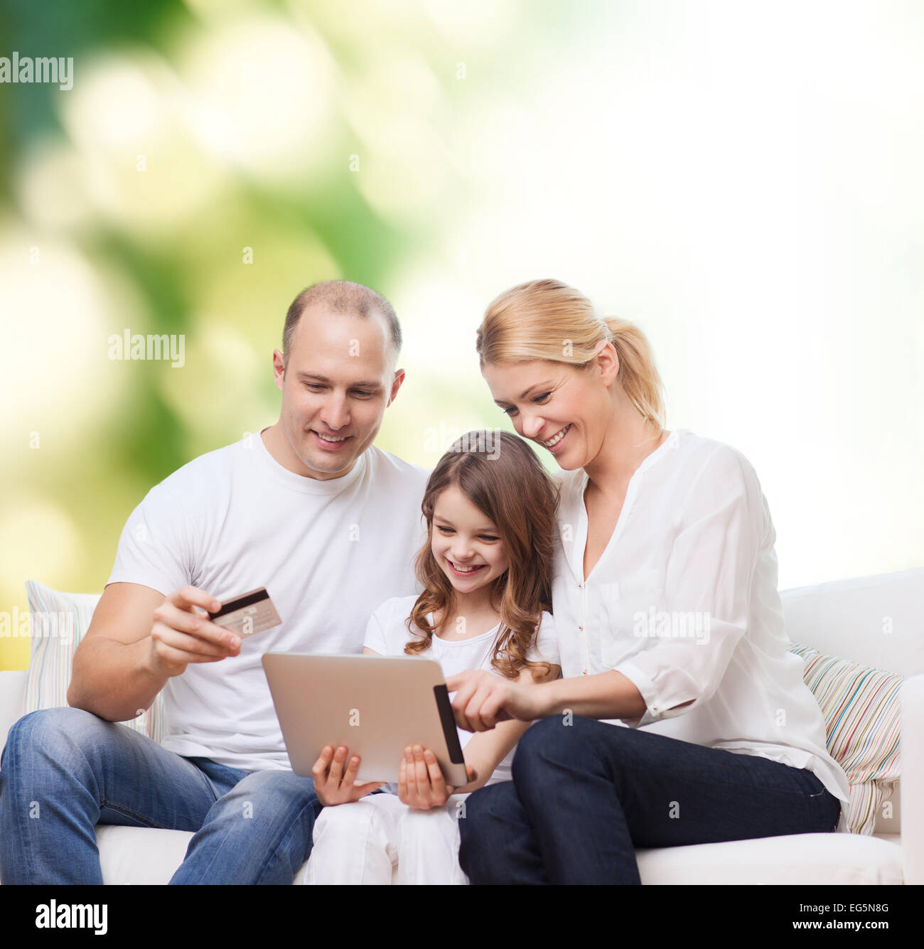 happy family with tablet pc and credit card Stock Photo - Alamy