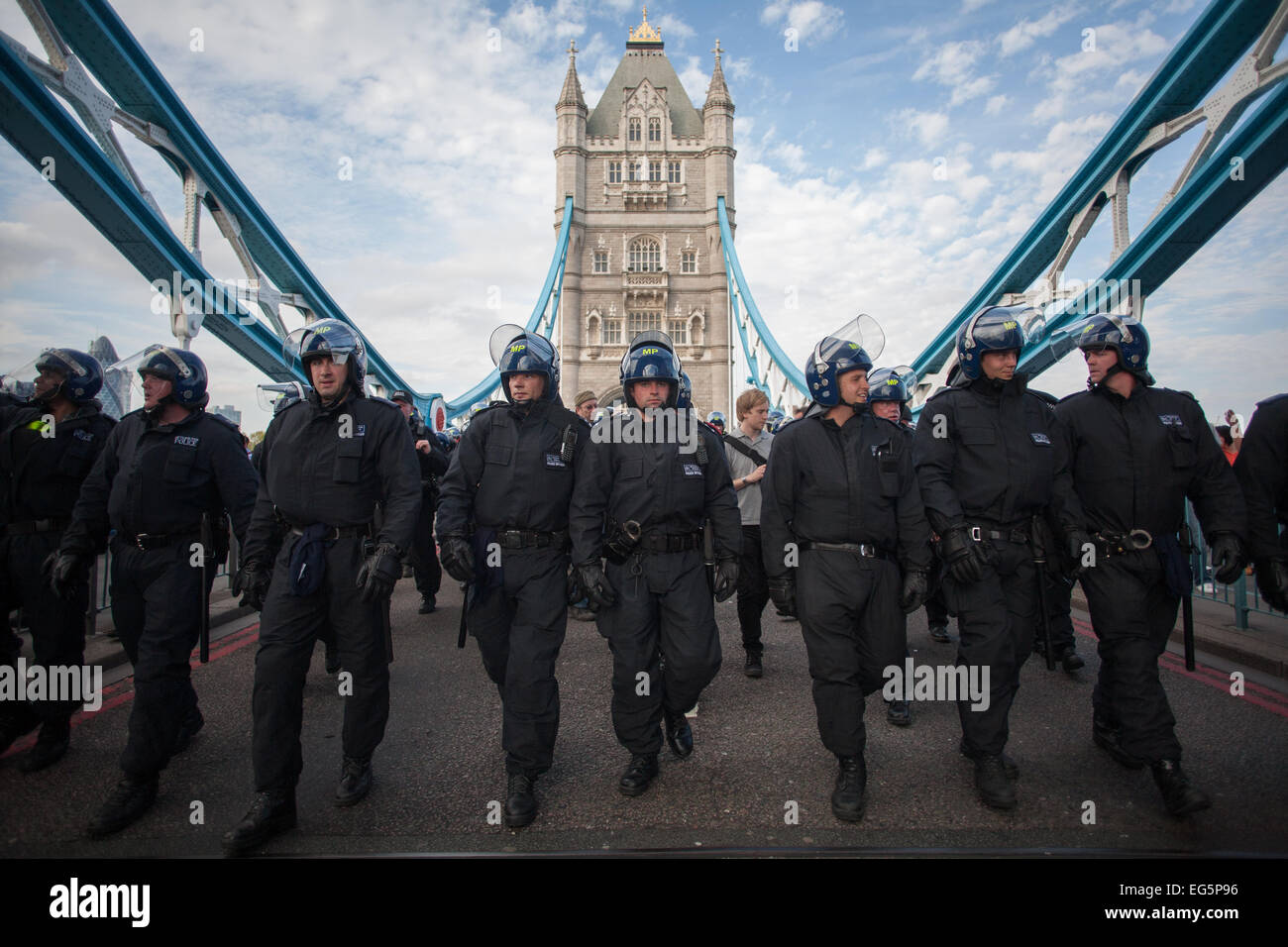Riot police passing trough Tower Bridge during English Defence League ...
