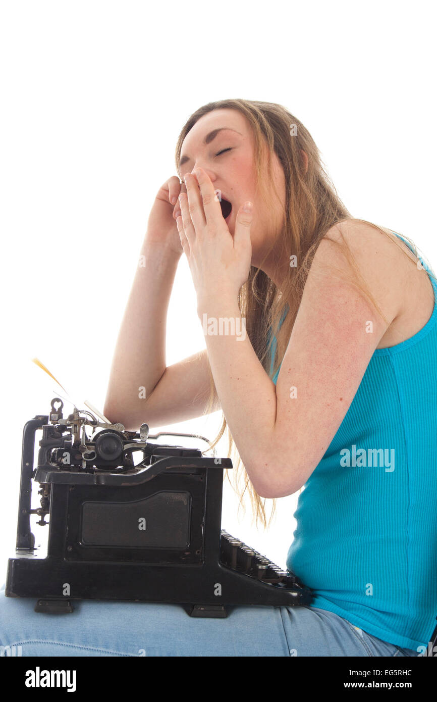Girl tired on a typewriter isolated on a white background Stock Photo ...