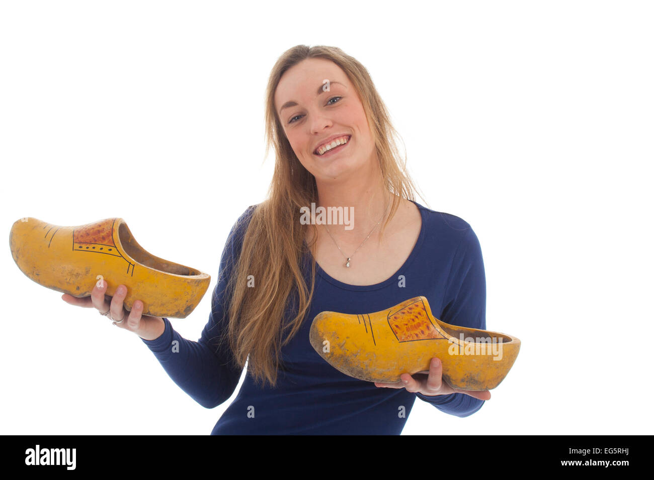 Girl from holland with clogs isolated over white Stock Photo - Alamy