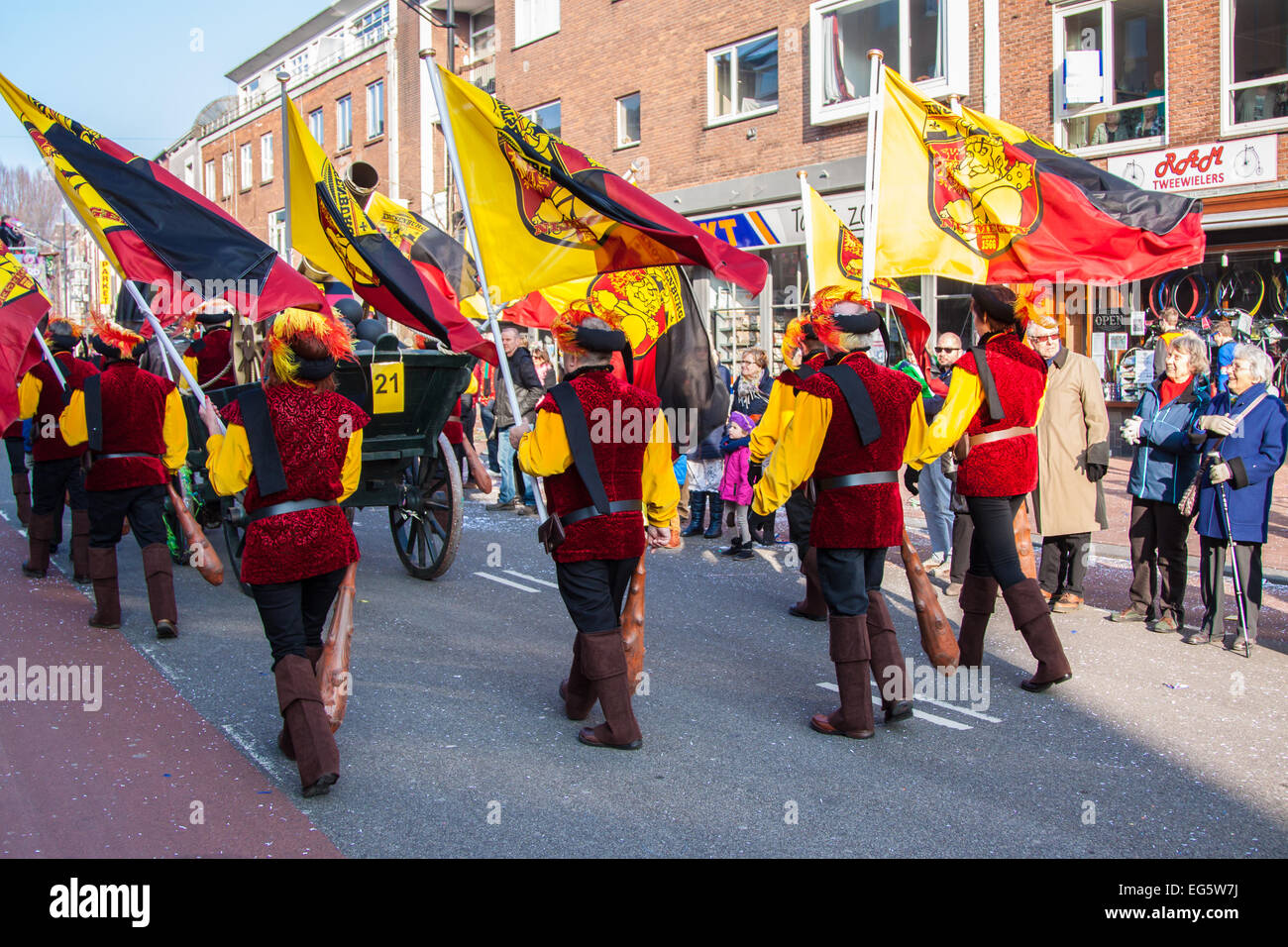People waving flags during Carnaval on the streets of dutch city ...