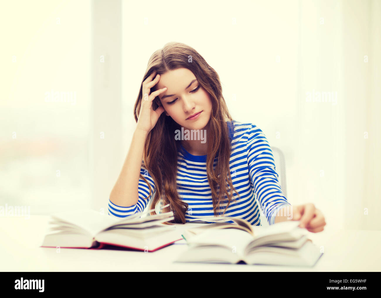 stressed student girl with books Stock Photo - Alamy