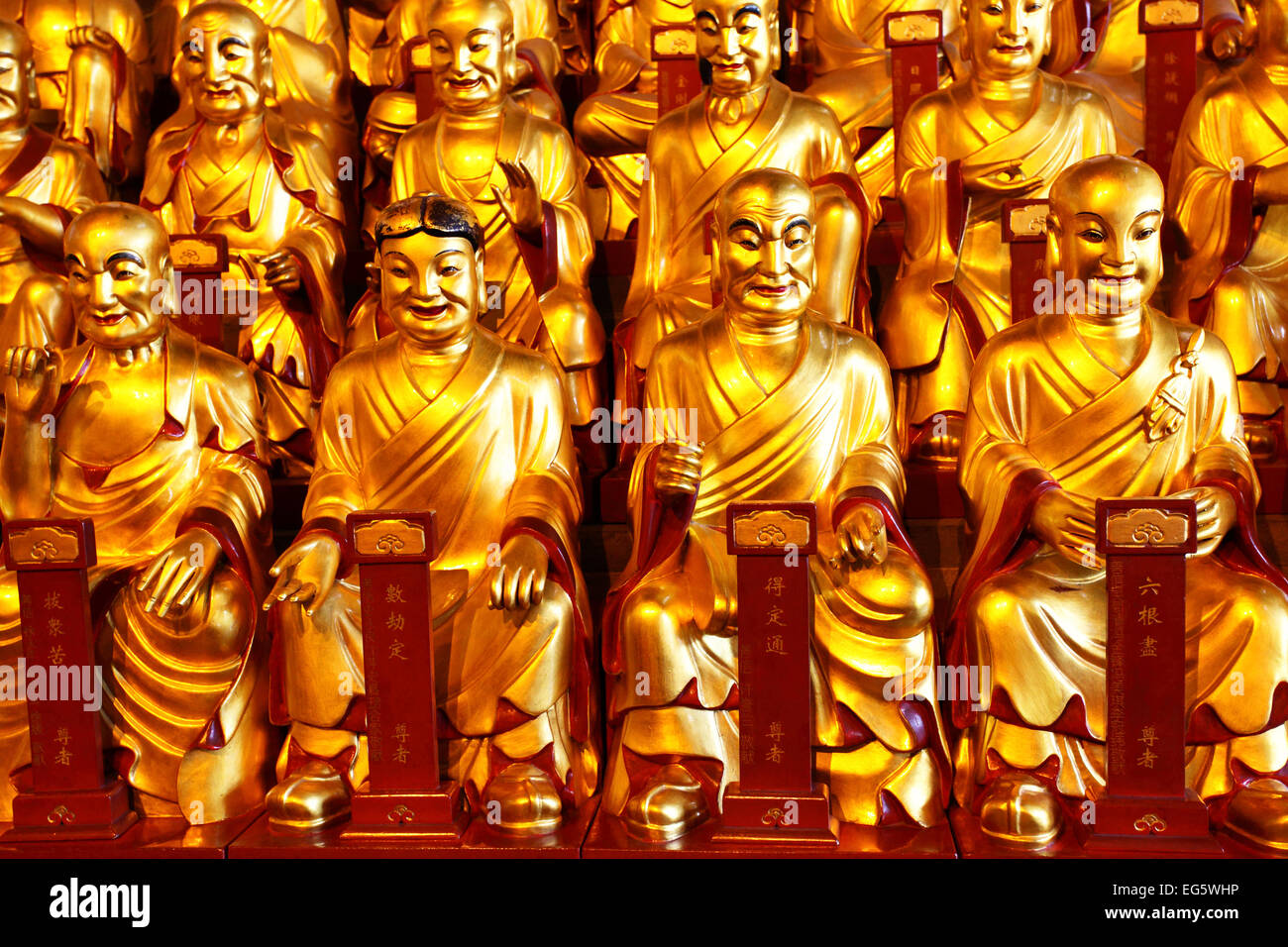 Gold statues of the Lohans in Longhua buddhist temple, Shanghai, China ...