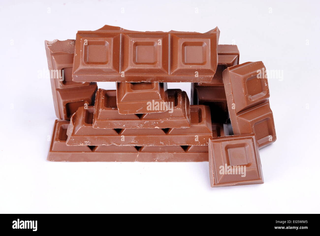 stack of chocolate pieces isolated on white background Stock Photo - Alamy