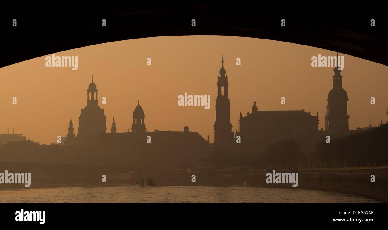 The Marien Bridge archway frames the silhouettes of Frauenkirche church ...