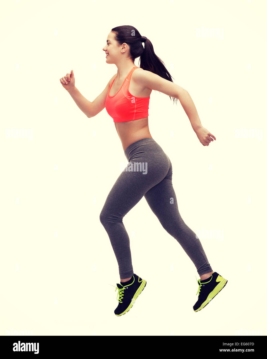 sporty woman running or jumping Stock Photo - Alamy