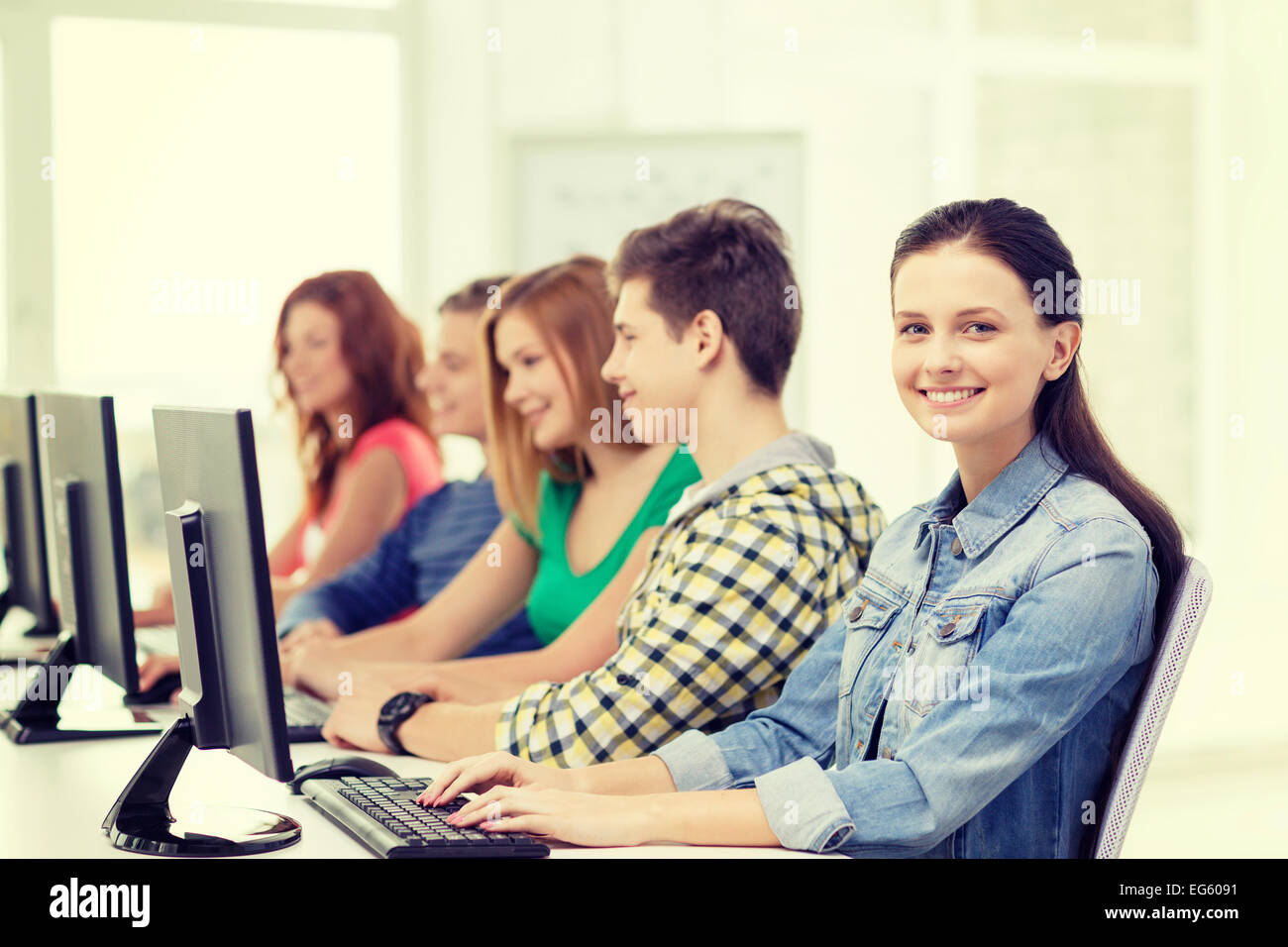 female student with classmates in computer class Stock Photo - Alamy