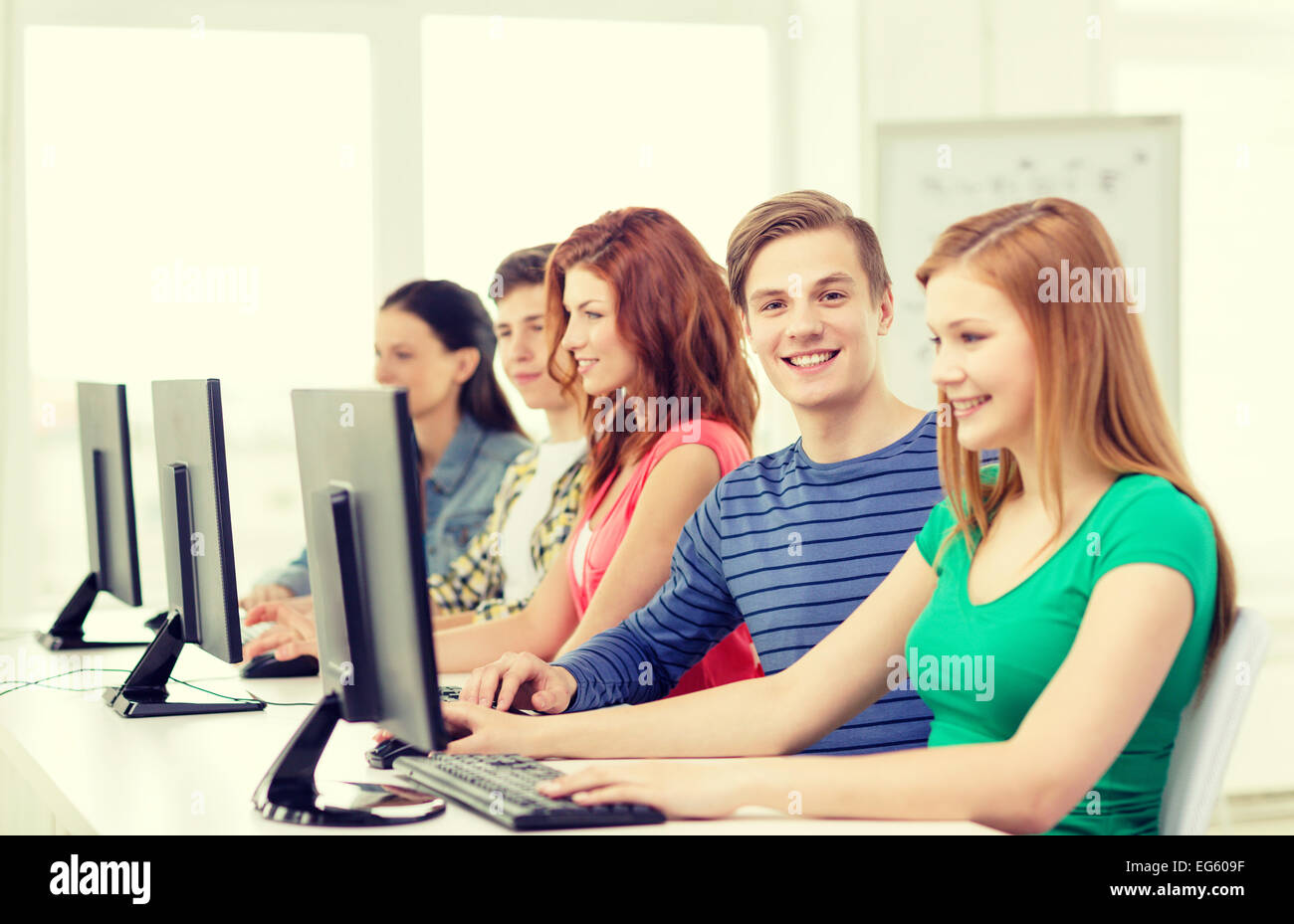 smiling student with computer studying at school Stock Photo - Alamy