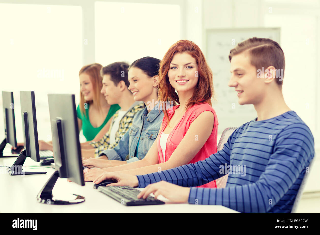 smiling student with computer studying at school Stock Photo - Alamy
