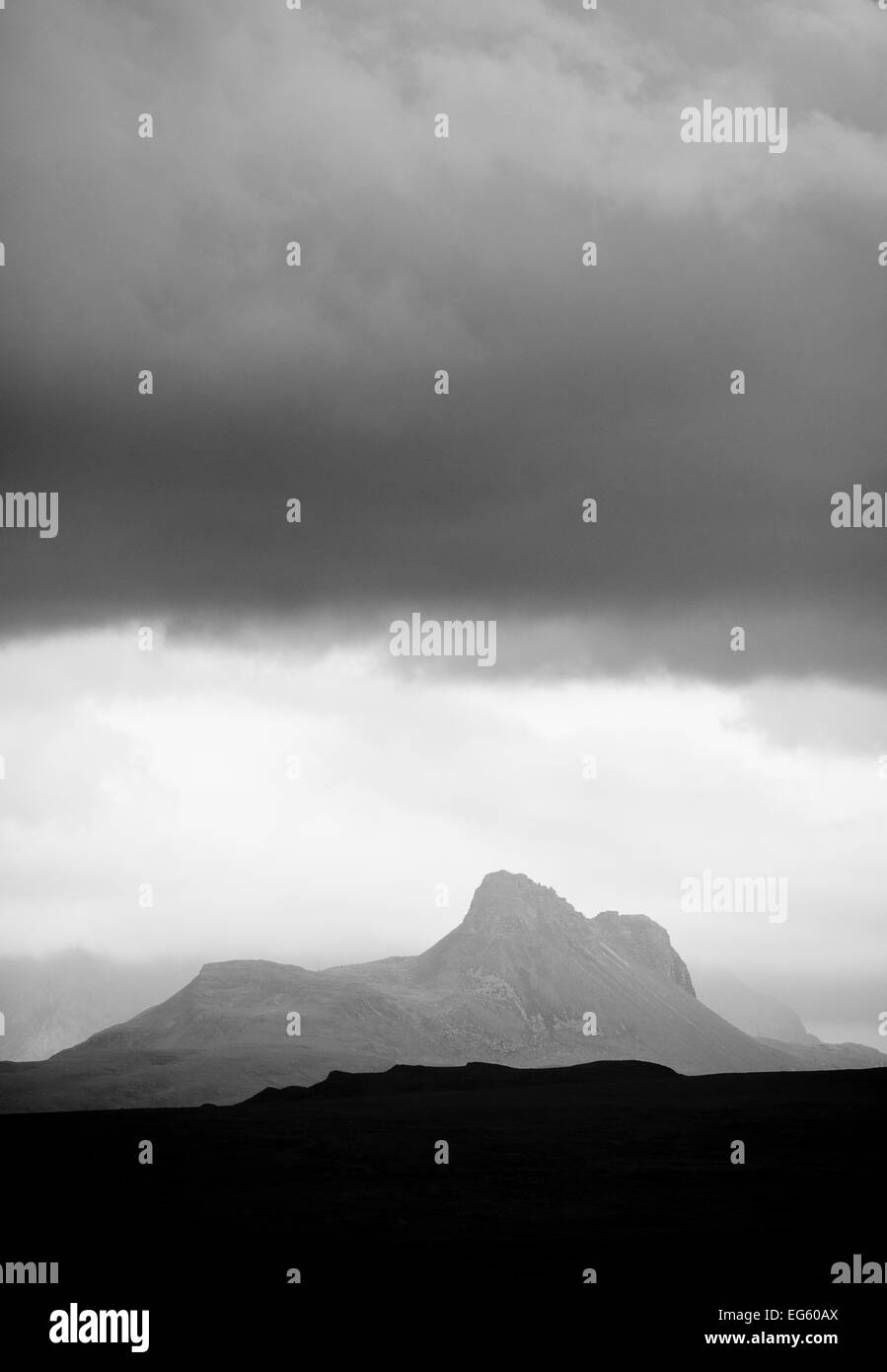 Silhouette of Stac Pollaidh against storm sky, viewed from Tanera More ...