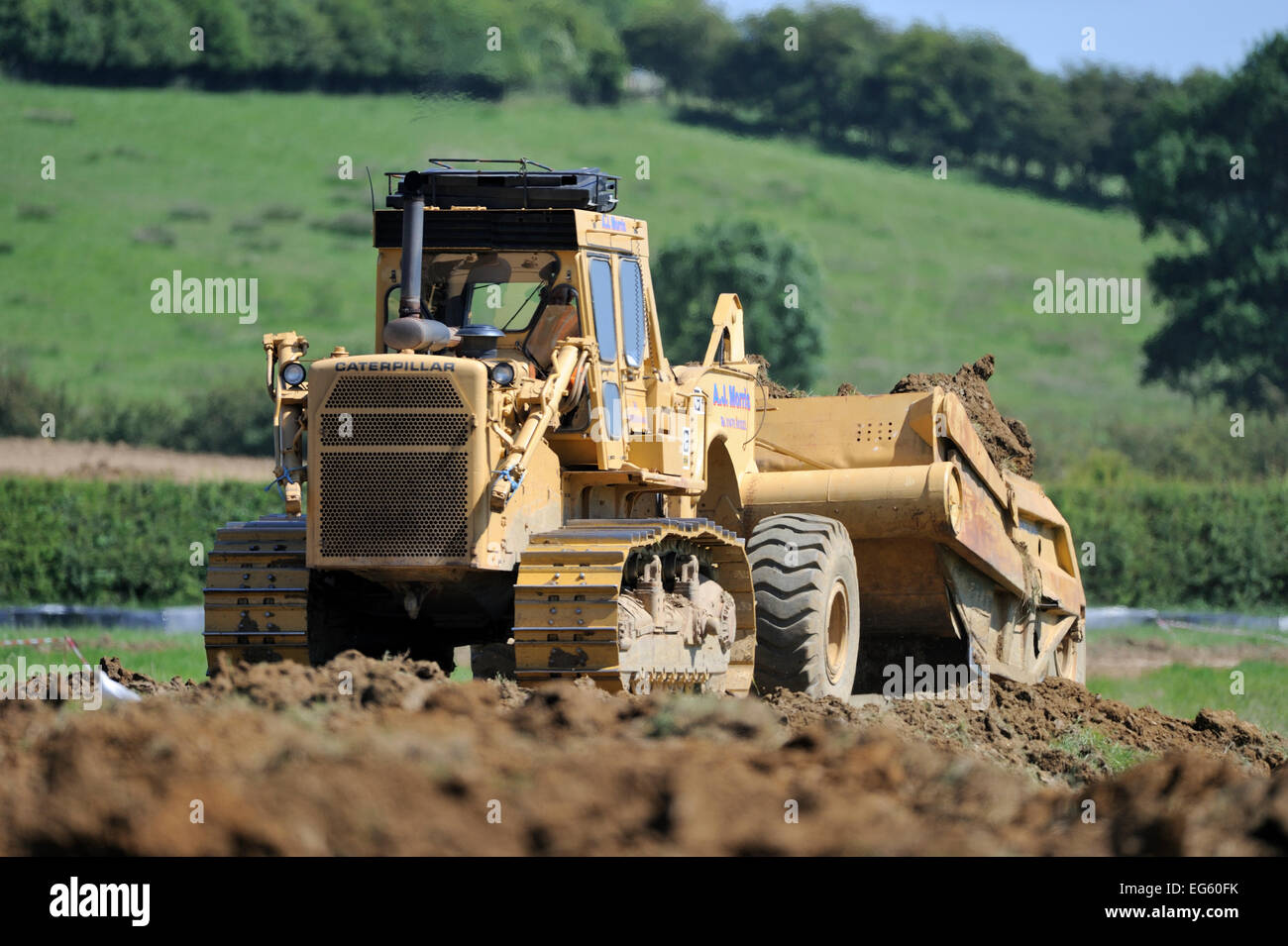 Machine creating earth embankment for lagoon at Rutland Water. Summer ...