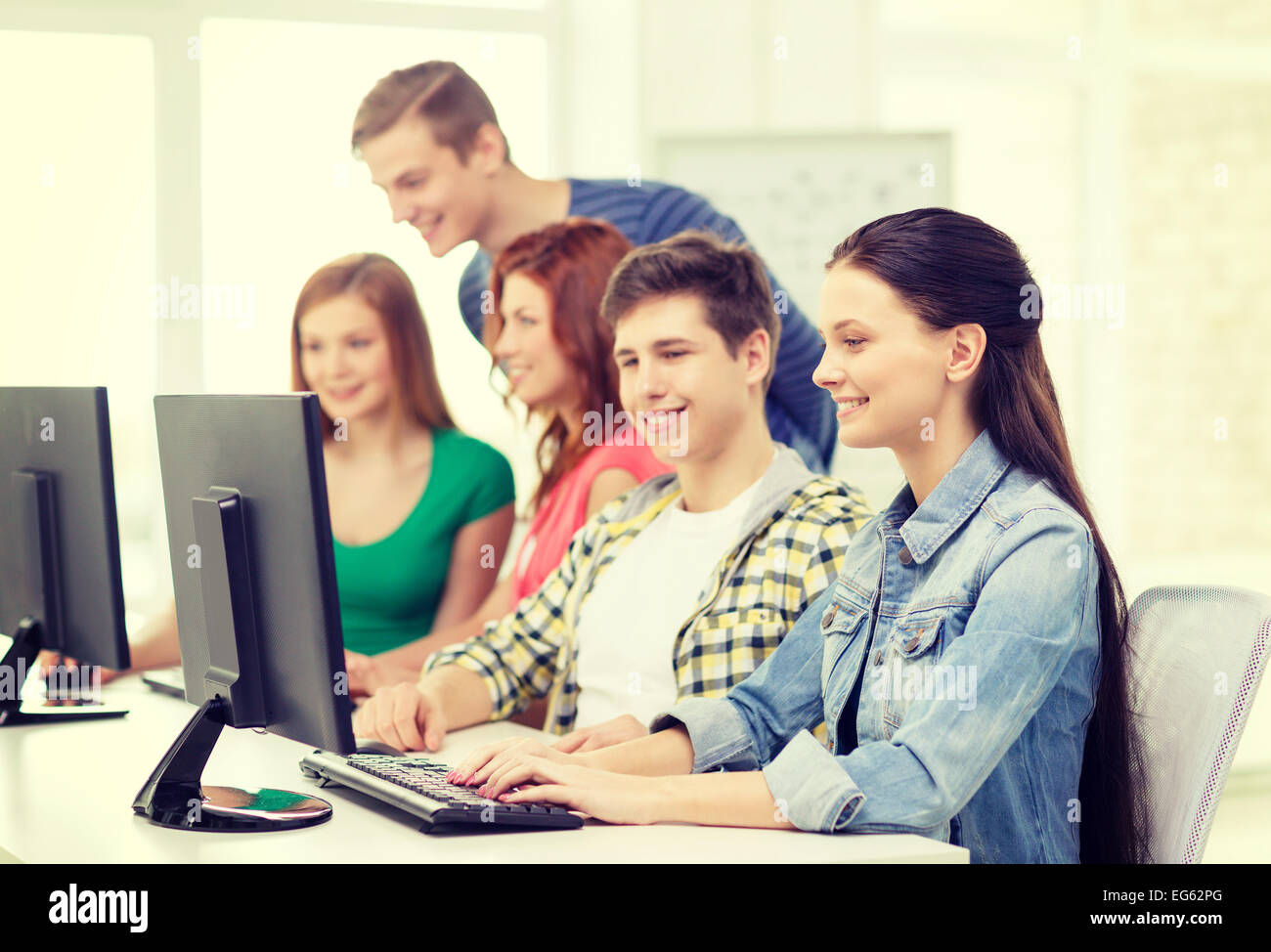 female student with classmates in computer class Stock Photo - Alamy