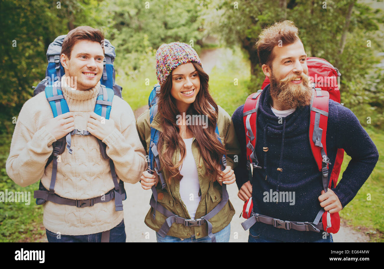 group of smiling friends with backpacks hiking Stock Photo - Alamy