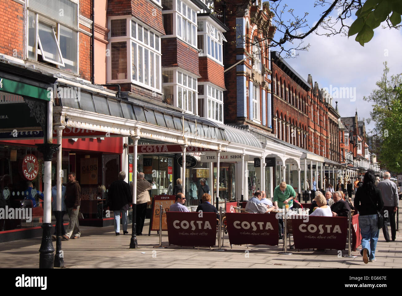 Lord Street with shops and outdoor coffee shop seating on the pavement ...