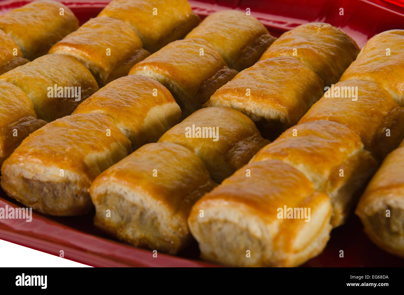 a plate of cooked sausage rolls Stock Photo - Alamy