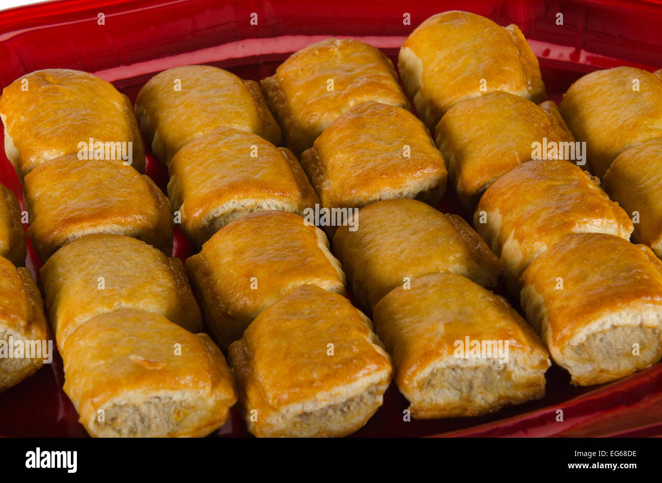 a plate of cooked sausage rolls Stock Photo - Alamy