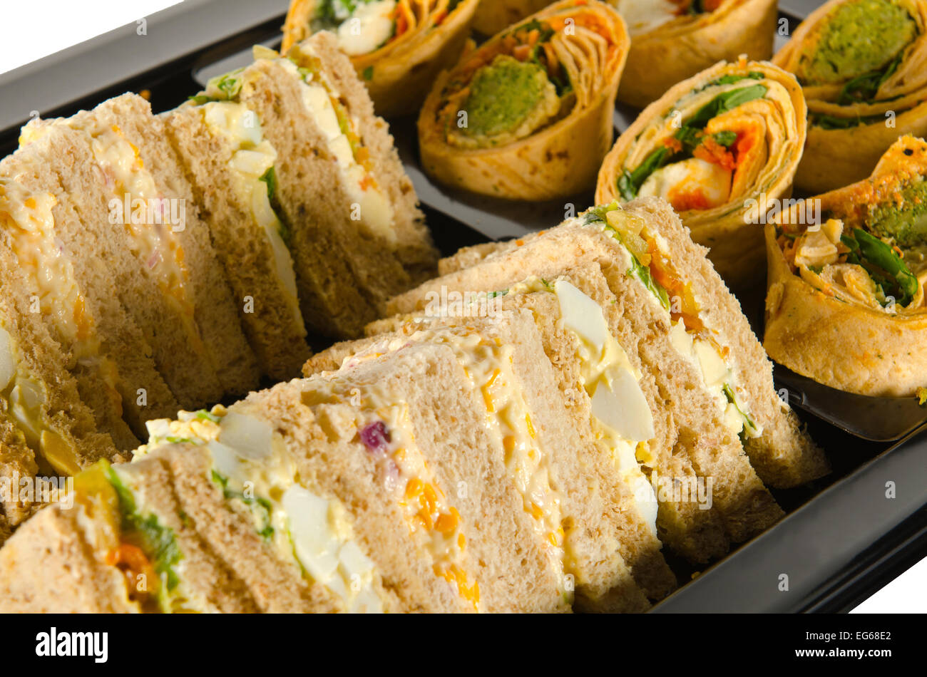 a plate of party food, wraps rolls and sandwiches Stock Photo - Alamy