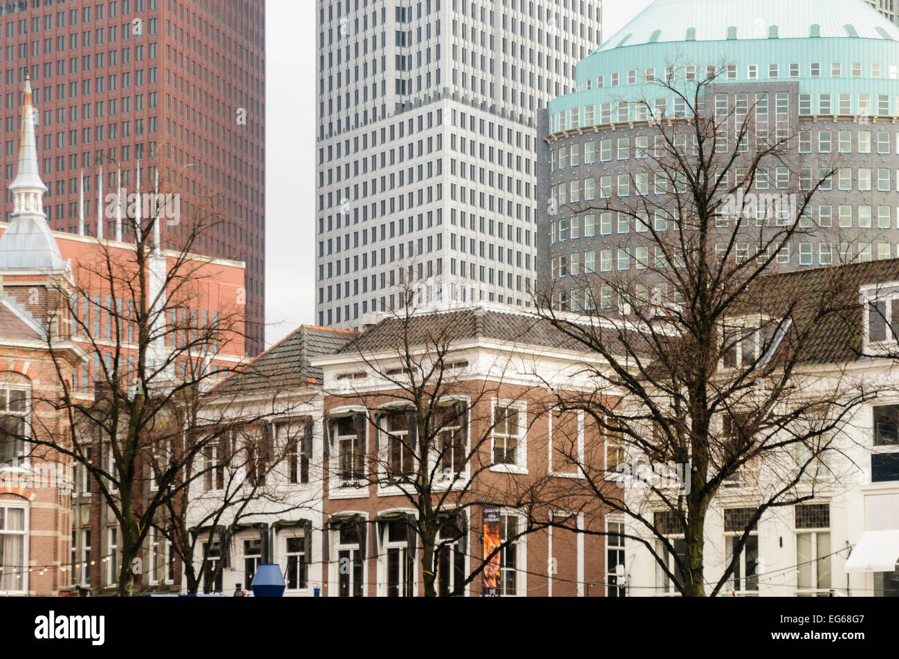 Modern skyscrapers tower over traditional Dutch buildings, Den Haag ...