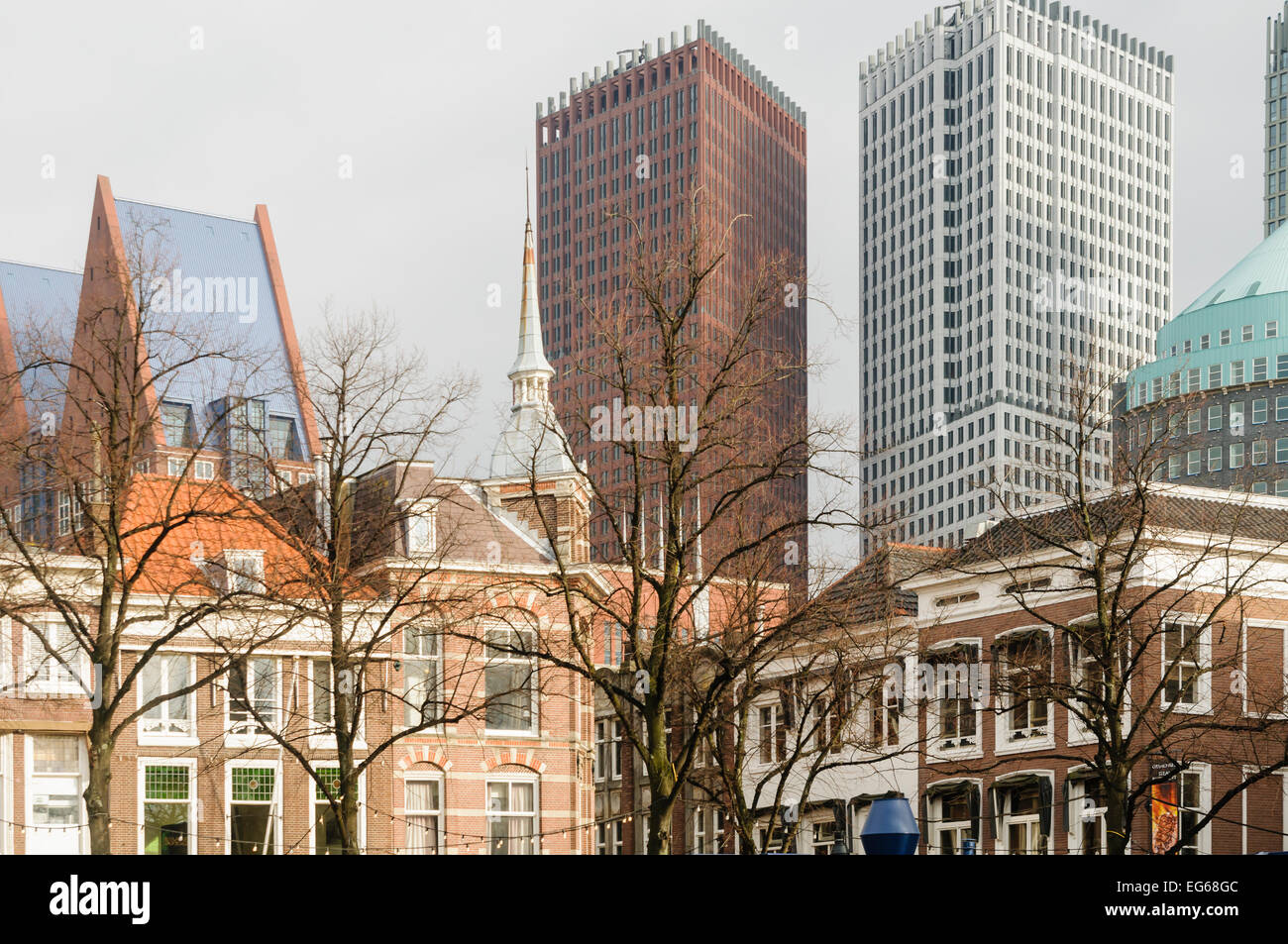 Modern skyscrapers tower over traditional Dutch buildings, Den Haag ...
