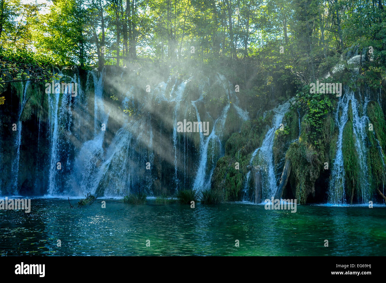 Sunlight through waterfall Stock Photo - Alamy