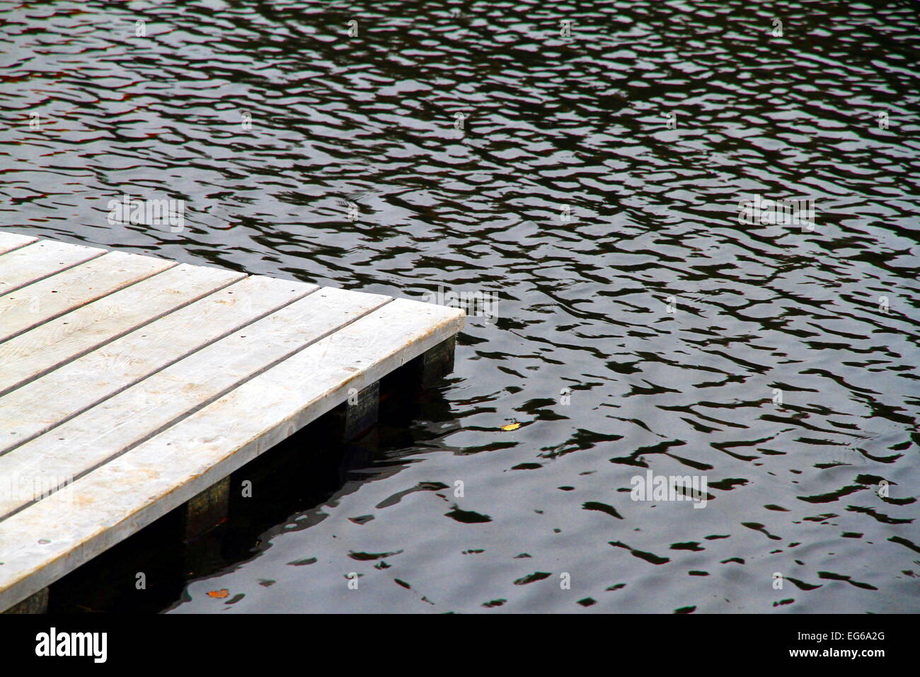 Wooden deck on the water Stock Photo - Alamy