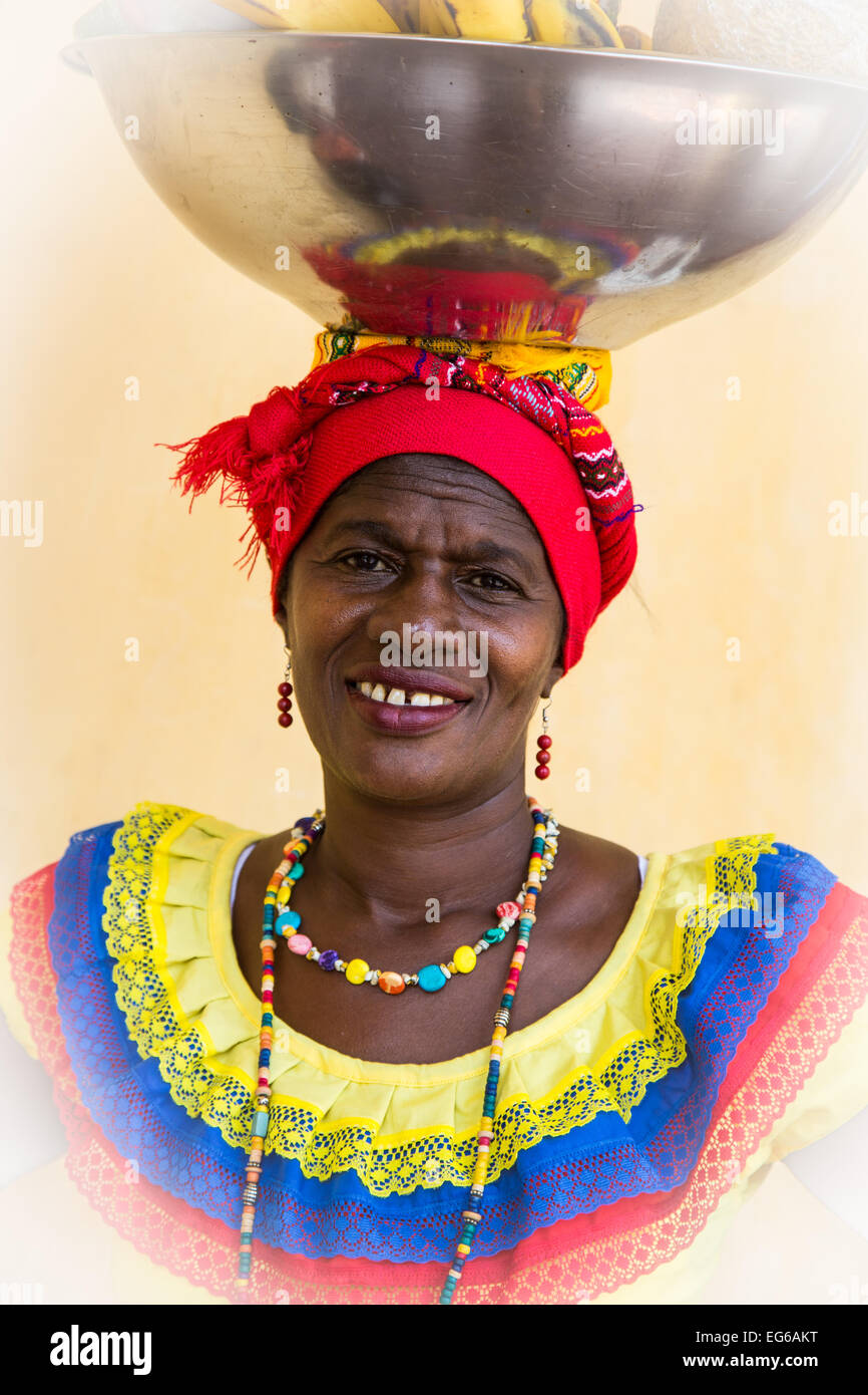 Cartagena, Colombia - February 22, 2014 - A woman in the iconic fruit ...