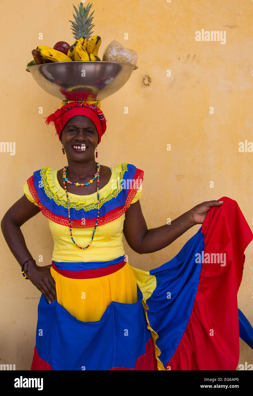 Cartagena, Colombia - February 22, 2014 - A woman in the iconic fruit ...