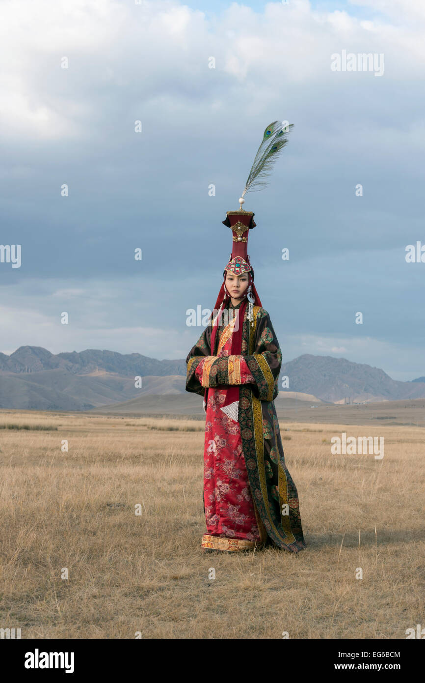Woman in Mongolian queen attire on the steppes, near Ulaan Baatar ...