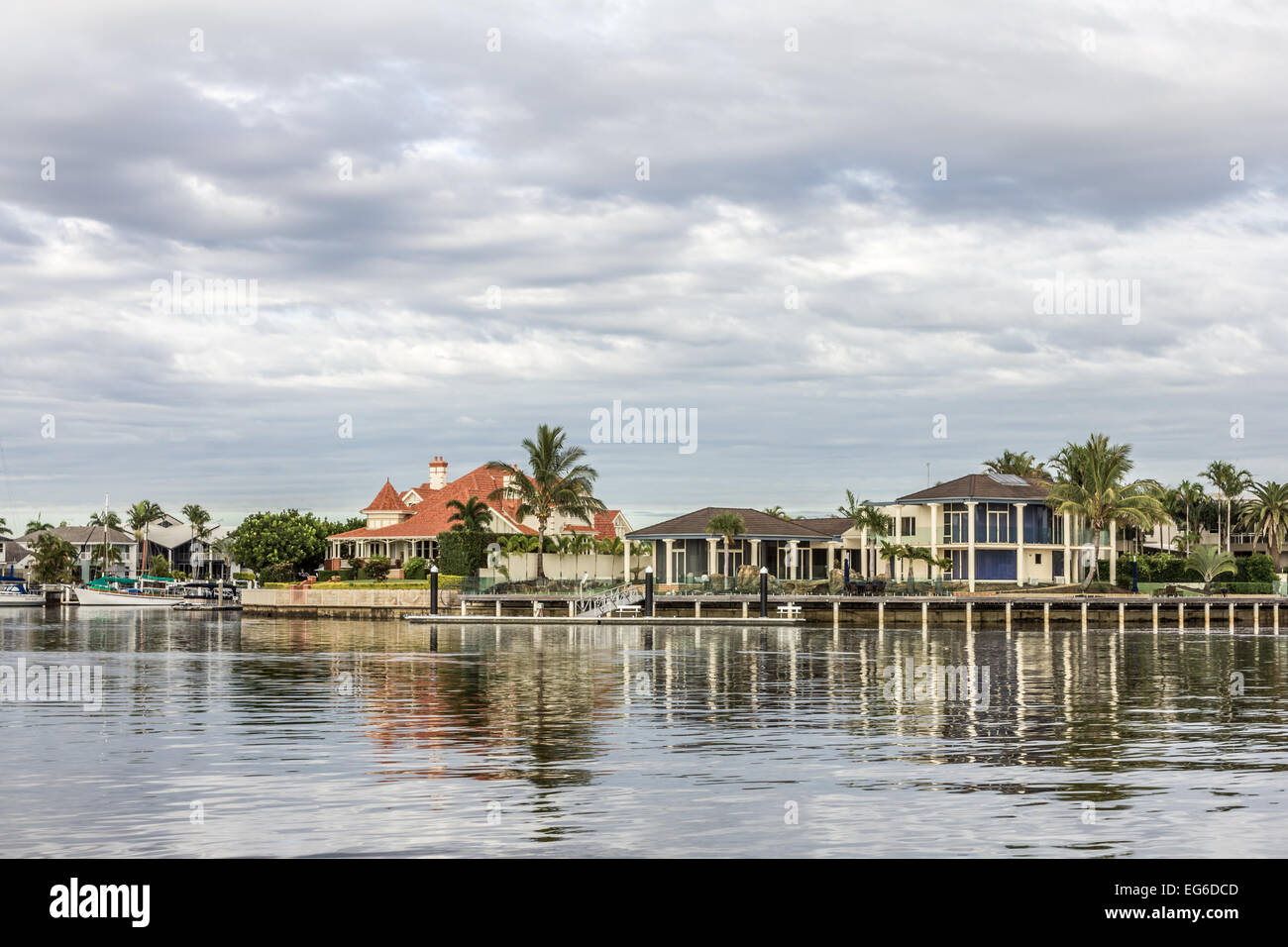 Luxury waterfront homes line a man made canal at Mooloolaba, Sunshine ...