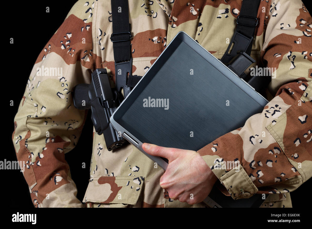 Close up horizontal image of laptop computer with armed male soldier ...