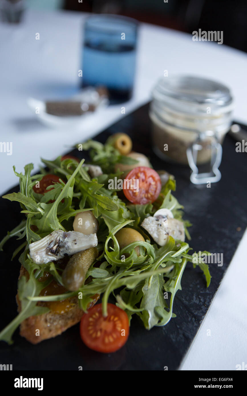 Potted duck with a salad of roasted artichoke, cornichons, tomato and ...