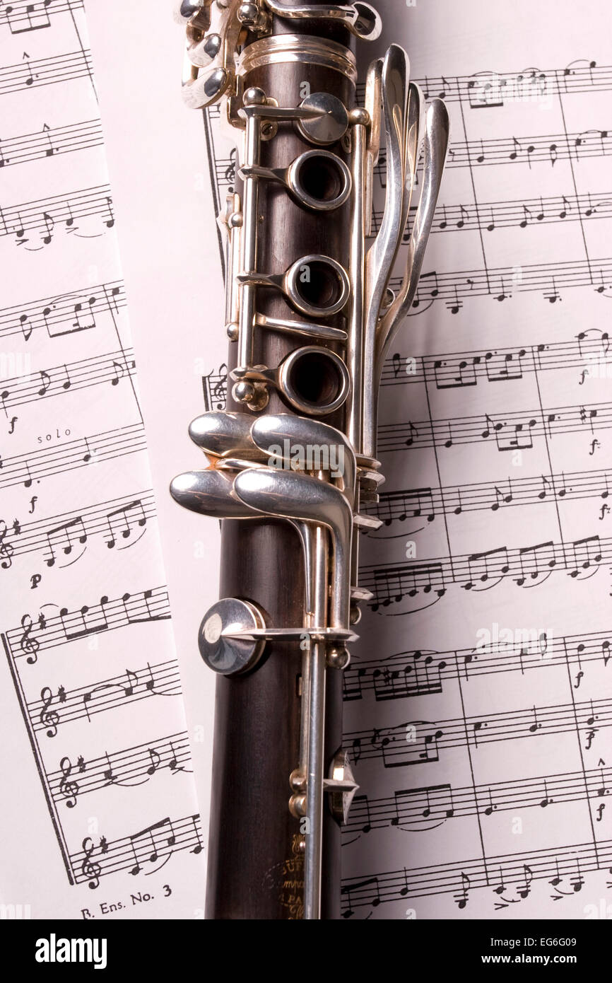 Photograph of a clarinet isolated over sheet music Stock Photo - Alamy