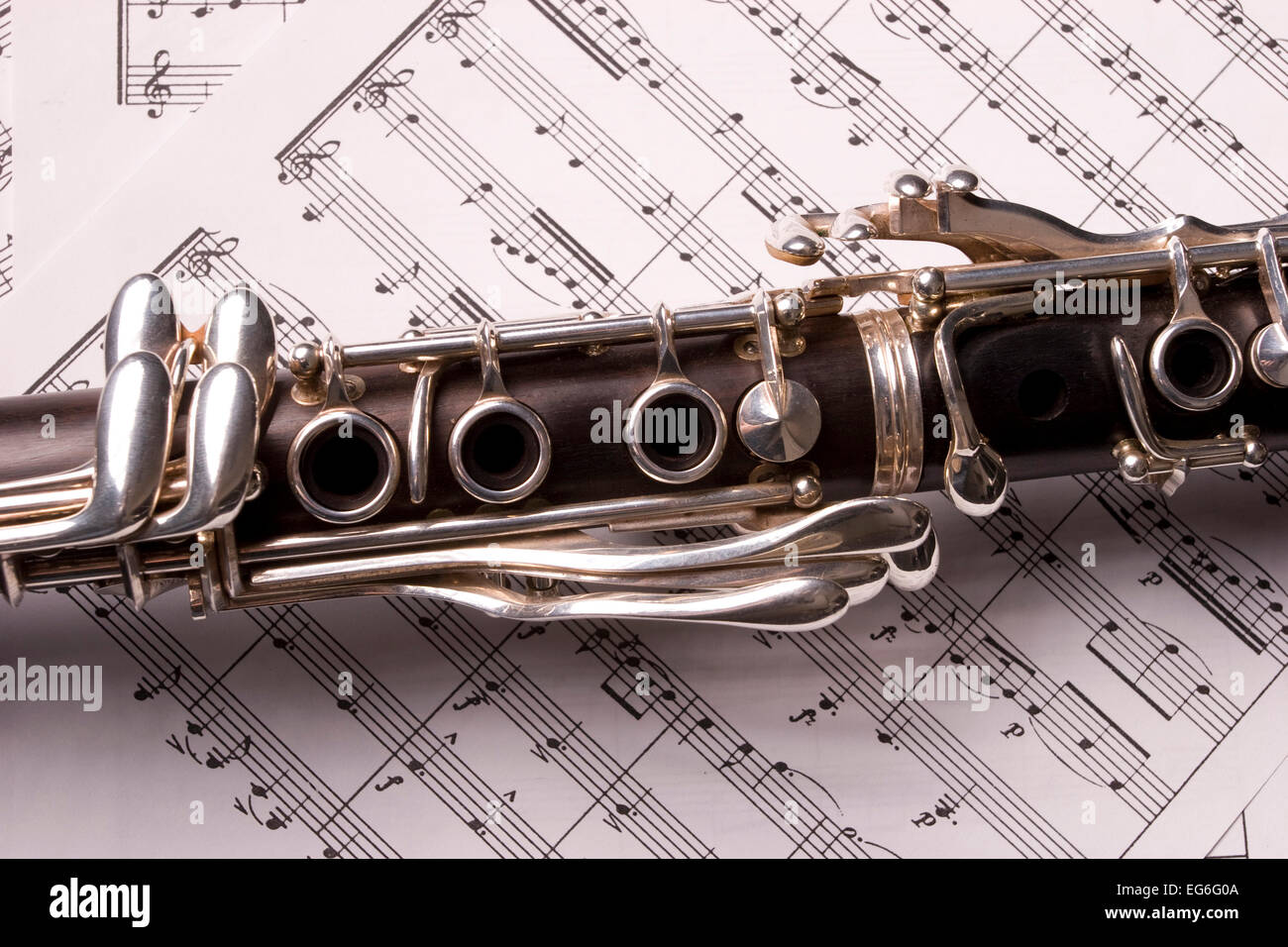 Photograph of a clarinet isolated over sheet music Stock Photo - Alamy