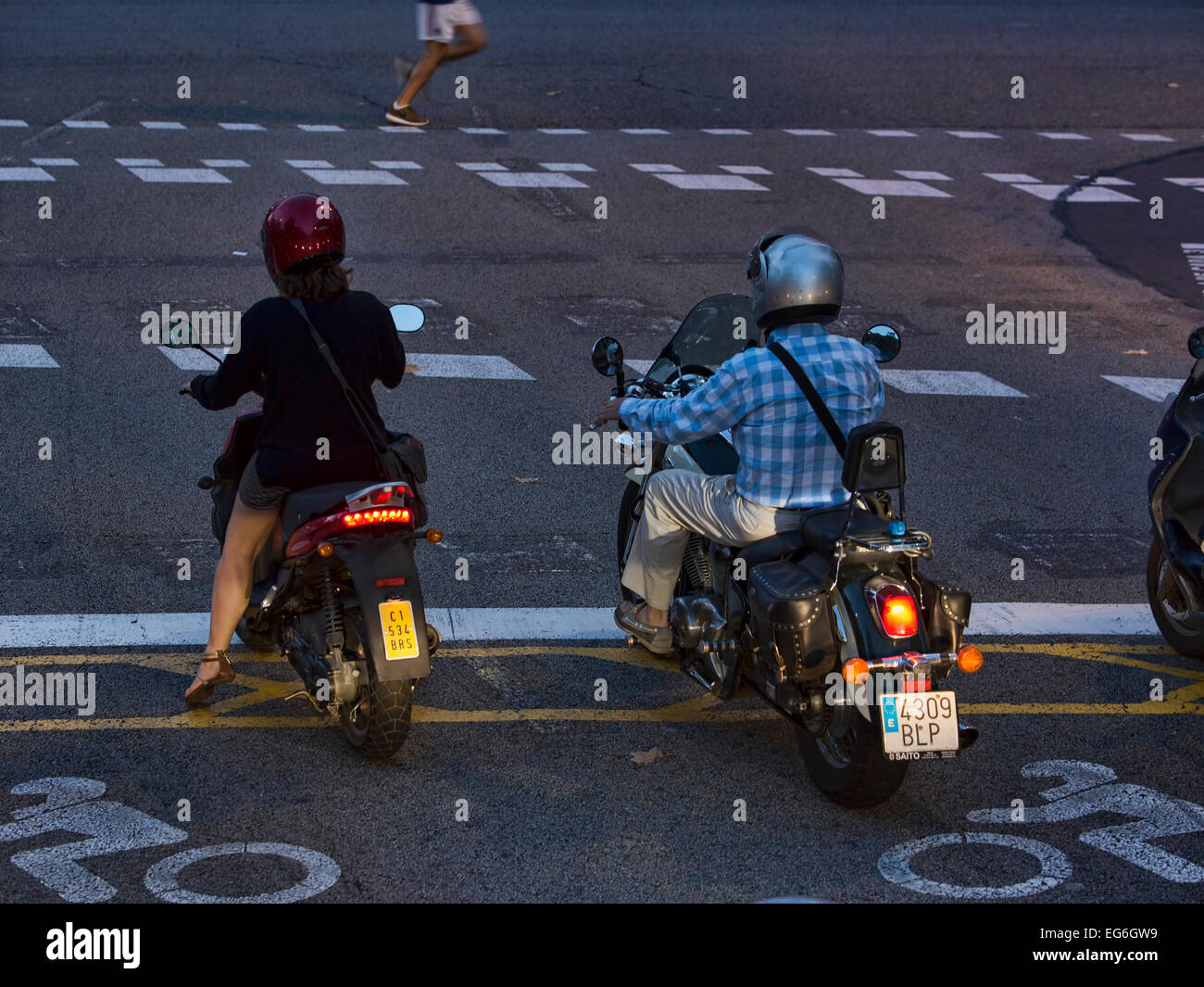Barcelona, Spain couple motorcycles evening ride Stock Photo - Alamy