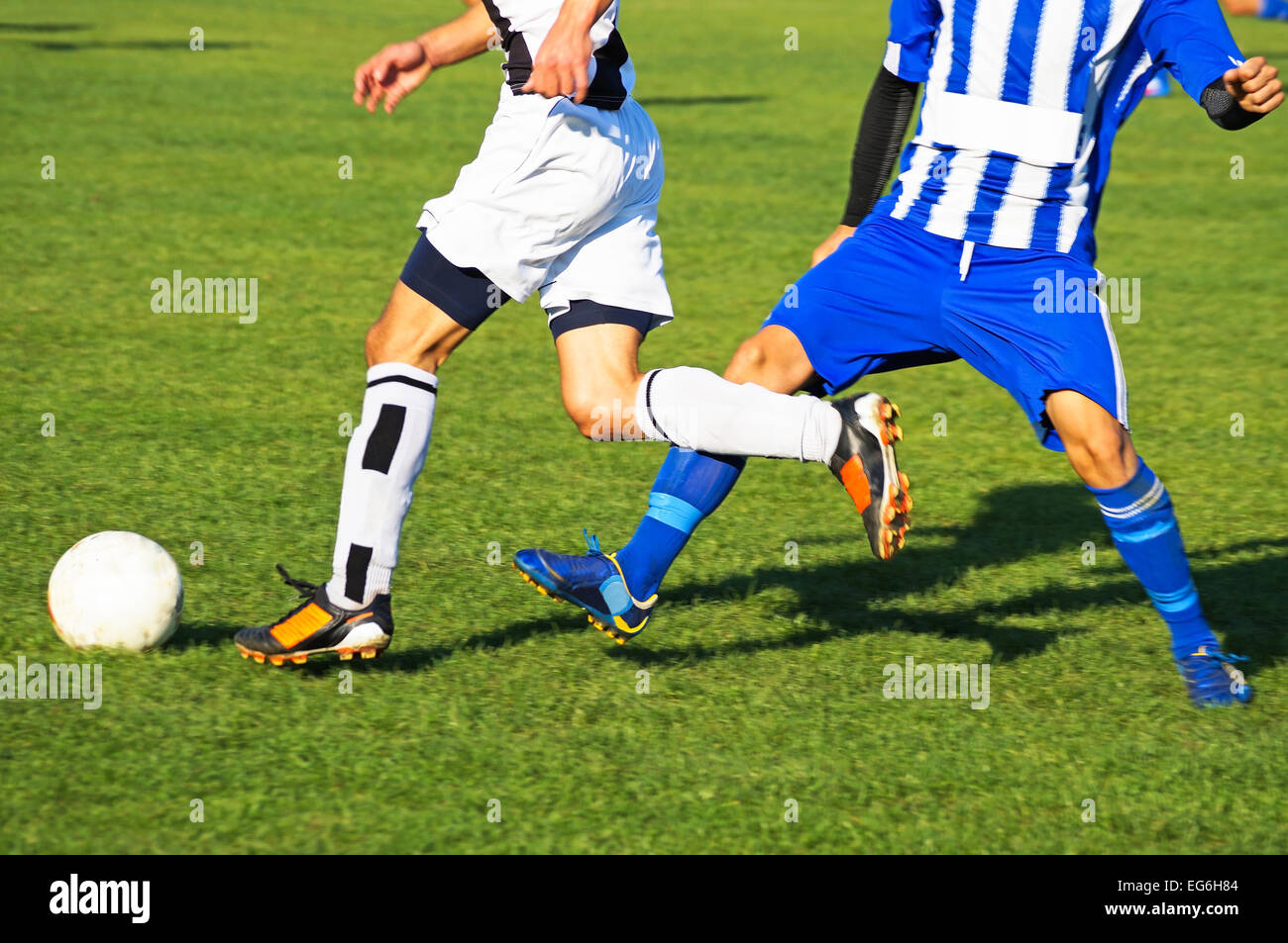 Soccer players in action Stock Photo - Alamy