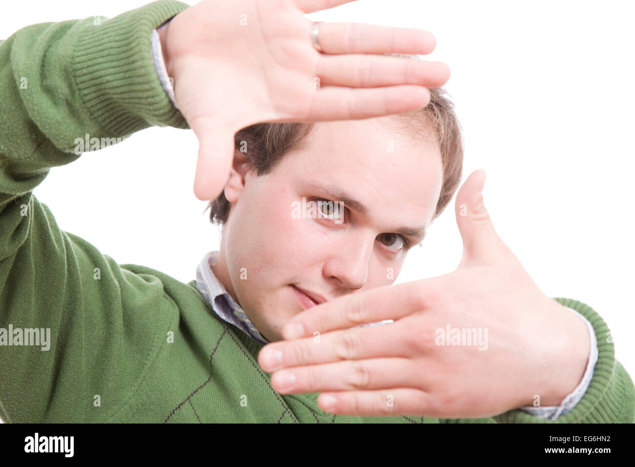 Young man showing framing hand gesture on an isolated background Stock ...