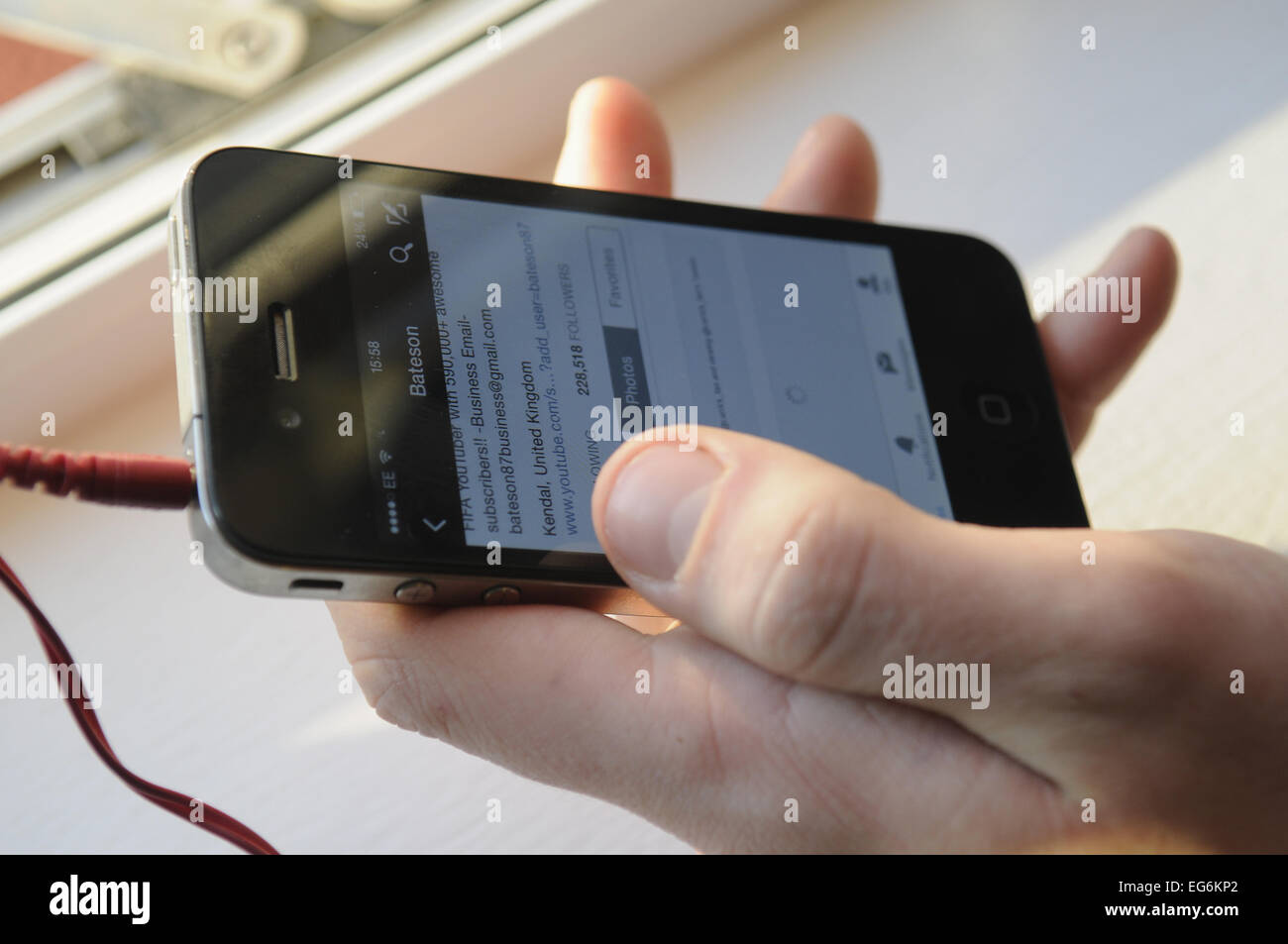 Teenage Boy Using An Apple iPhone 4 Stock Photo - Alamy