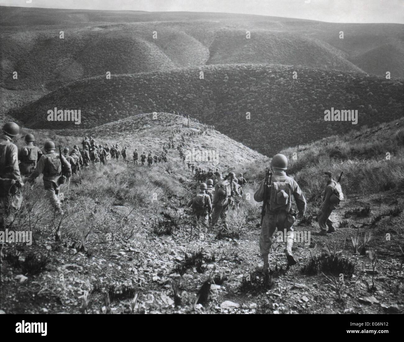 U.S. First Ranger Battalion on a speed march over hilly terrain at ...