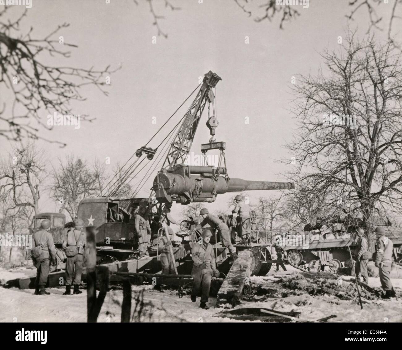 U.S. artillerymen in France assemble their 8 inch gun with the aid of a ...