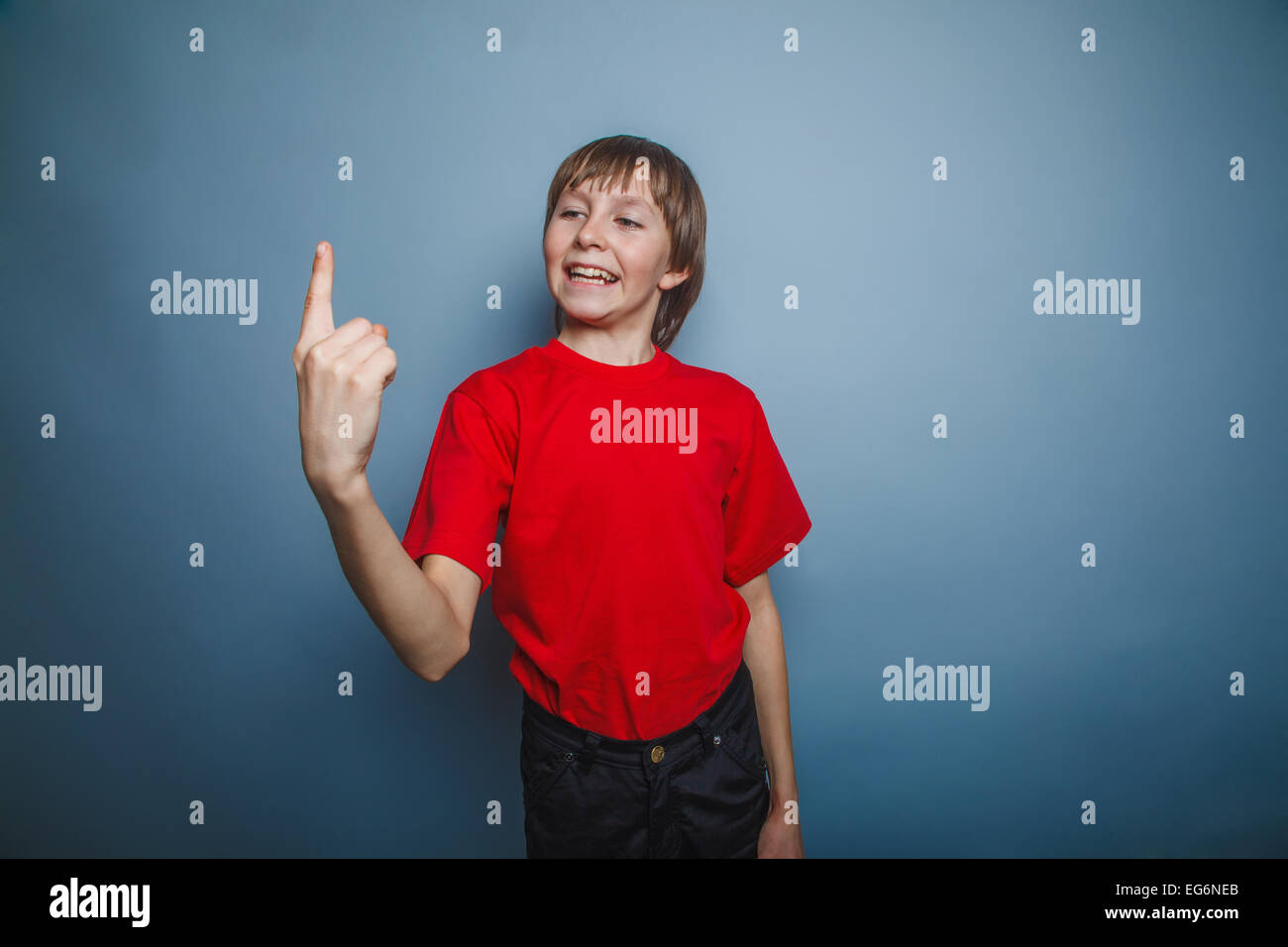 European-looking boy of ten years shows number one finger on a g Stock ...